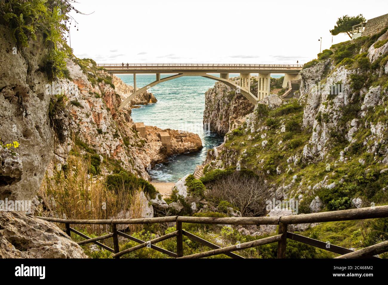 The Ciolo bridge connects two high cliffs. An inlet of the sea, in ...