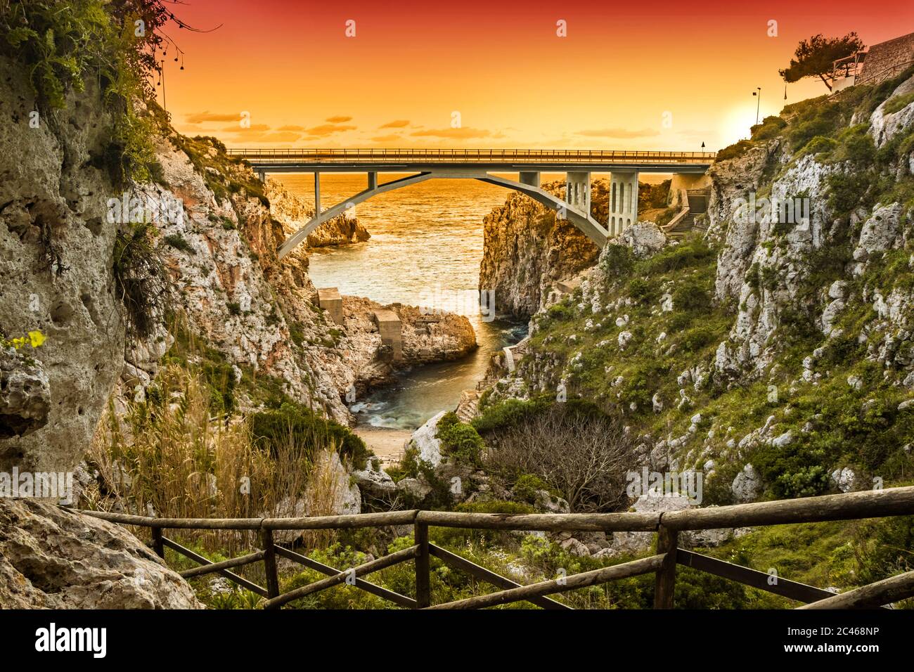 The Ciolo bridge connects two high cliffs. An inlet of the sea, in ...