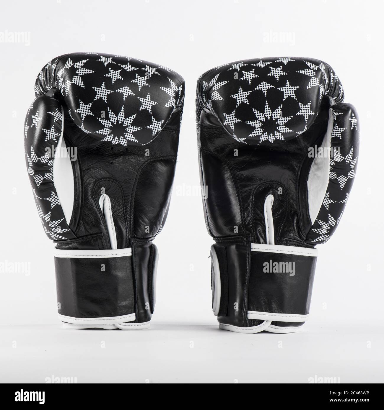 Black boxing gloves isolated on the white background Stock Photo - Alamy