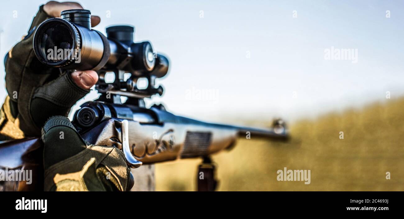 Hunt hunting rifle. Hunter man. Hunting period. Male with a gun. Close ...