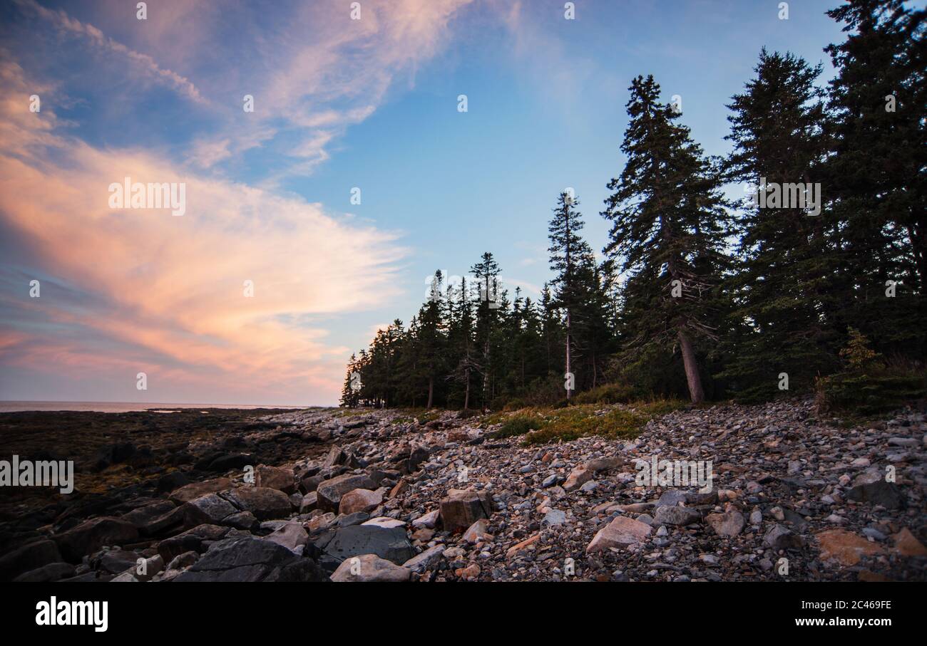 Seawall at sunset, a naturally occurring granite and loose boulder and ...