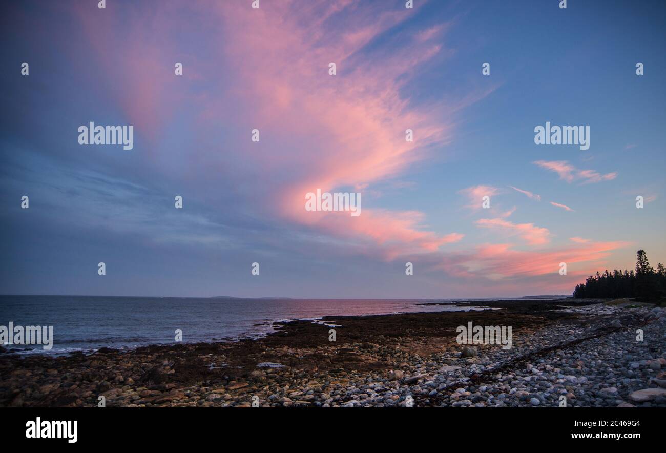 Seawall at sunset, a naturally occurring granite and loose boulder and ...