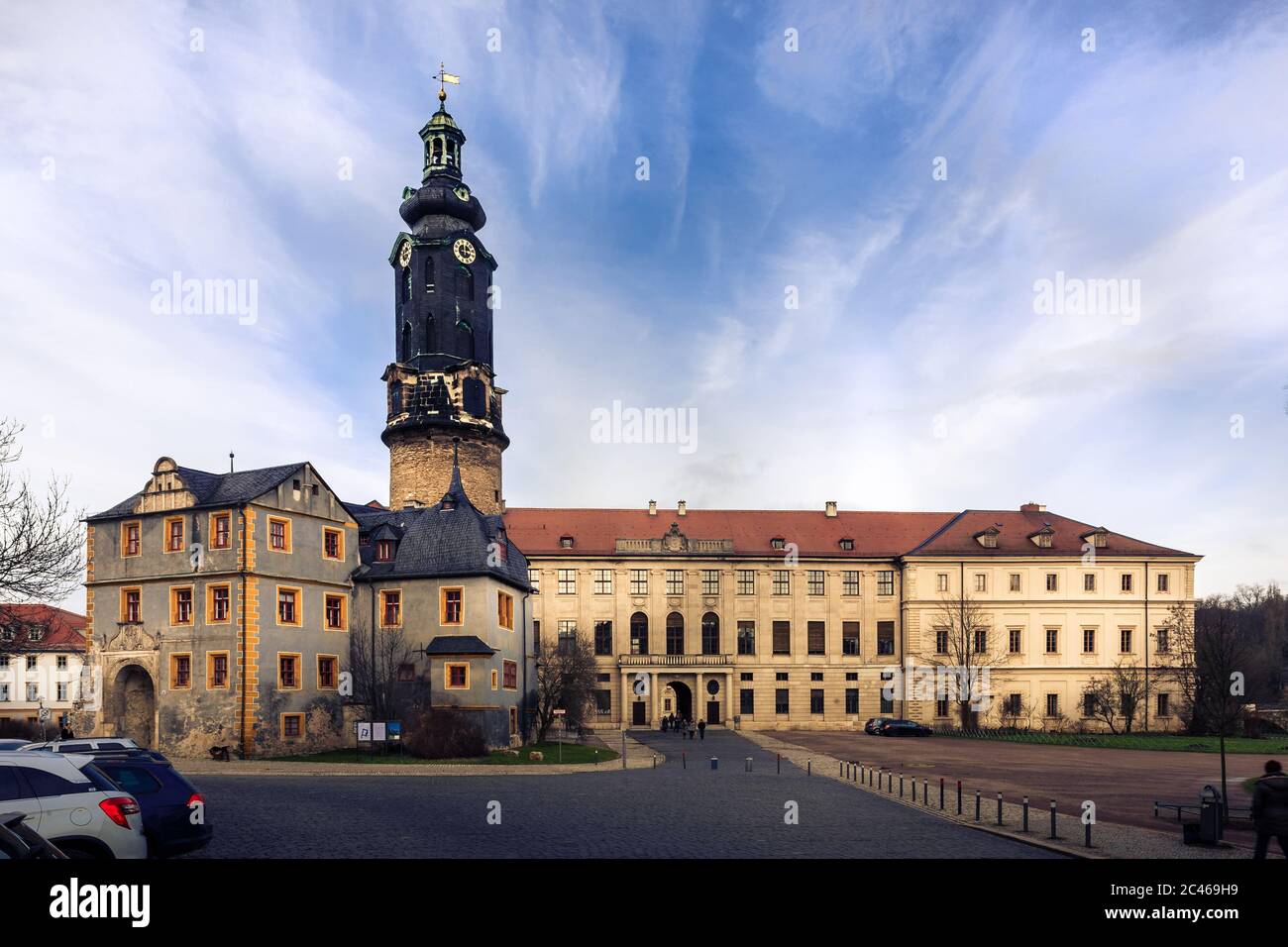 Schloss Weimar surrounded by cars under the blue cloudy sky in Weimar ...