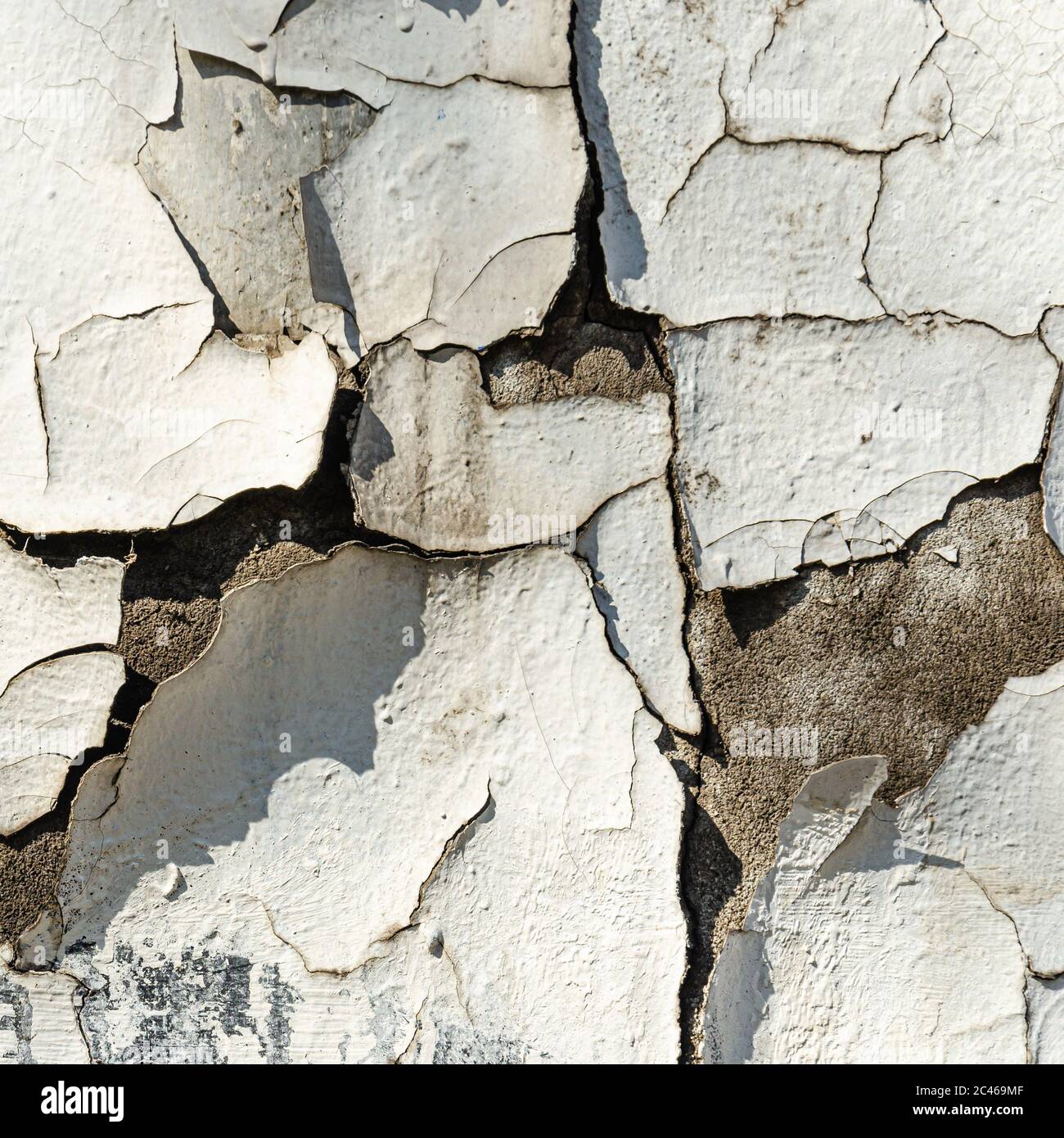 Old plaster wall surface. Abstract textured background. Deep cracks on ...