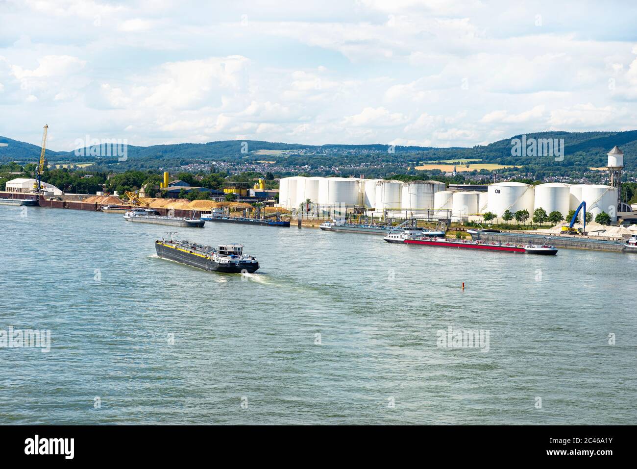 A large tanker ship sailing in Germany on the Rhine river visible ...