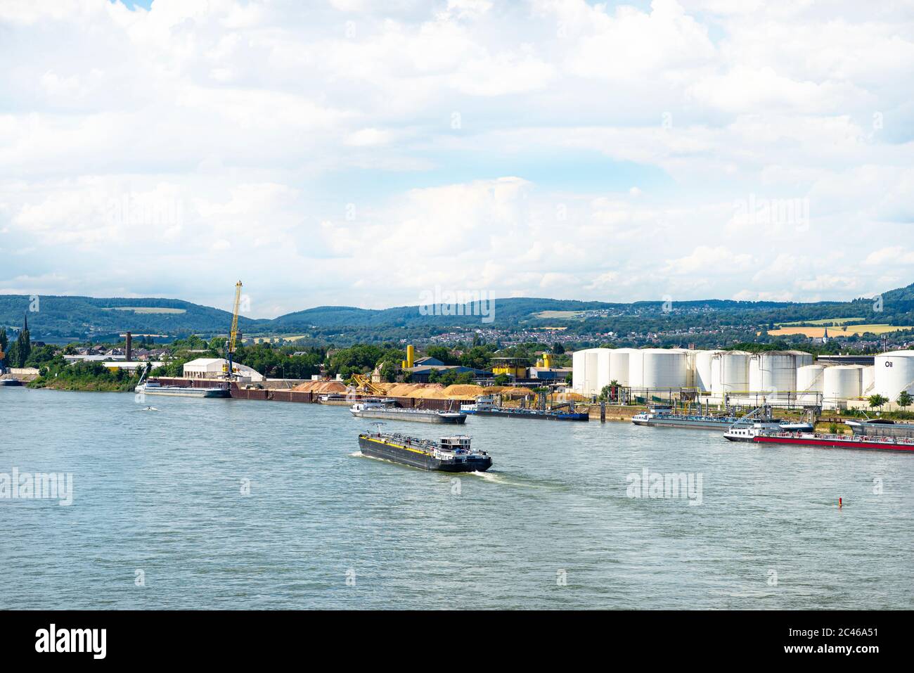 A large tanker ship sailing in Germany on the Rhine river visible ...