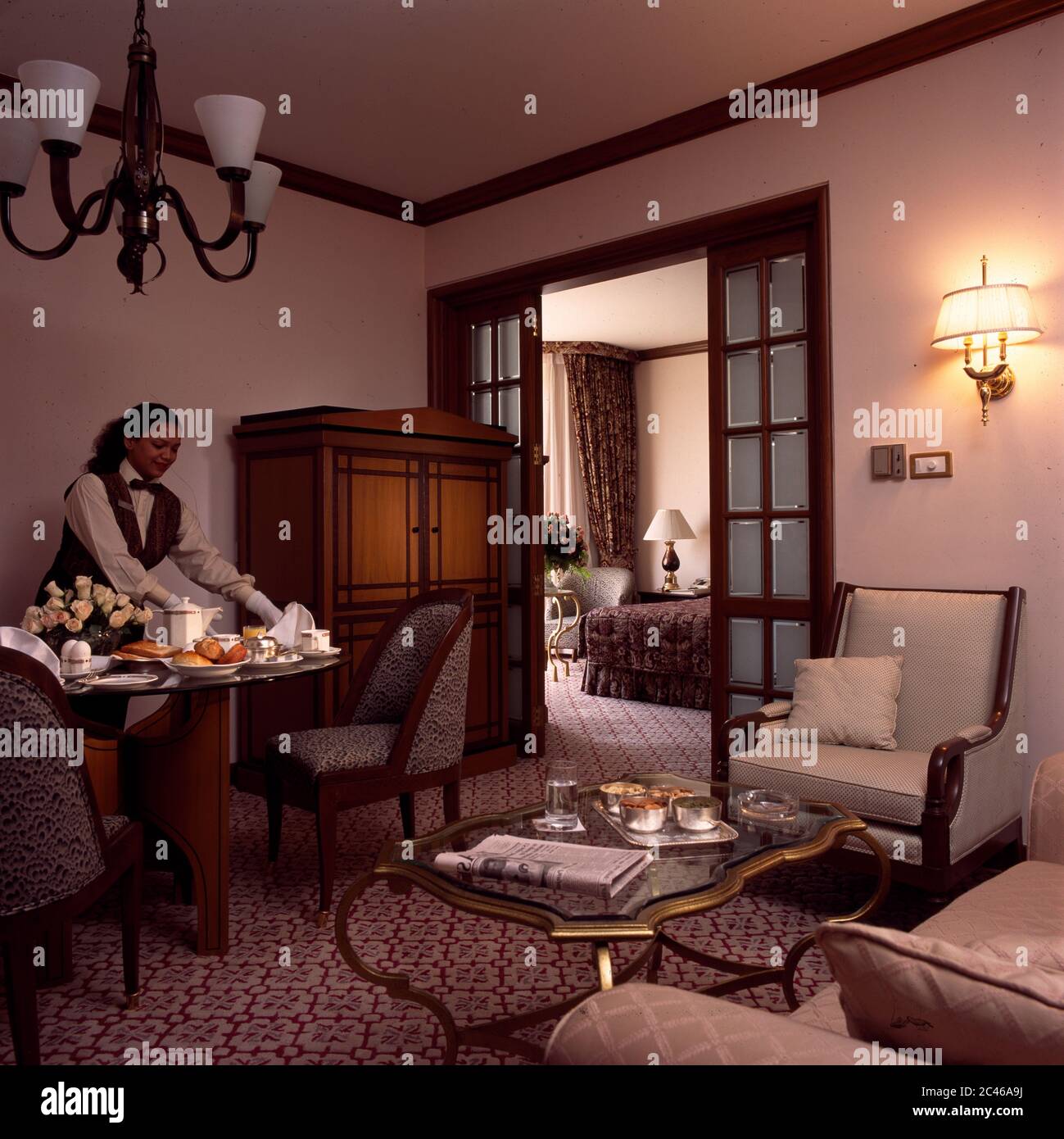 Waitress in hotel diningroom Stock Photo - Alamy