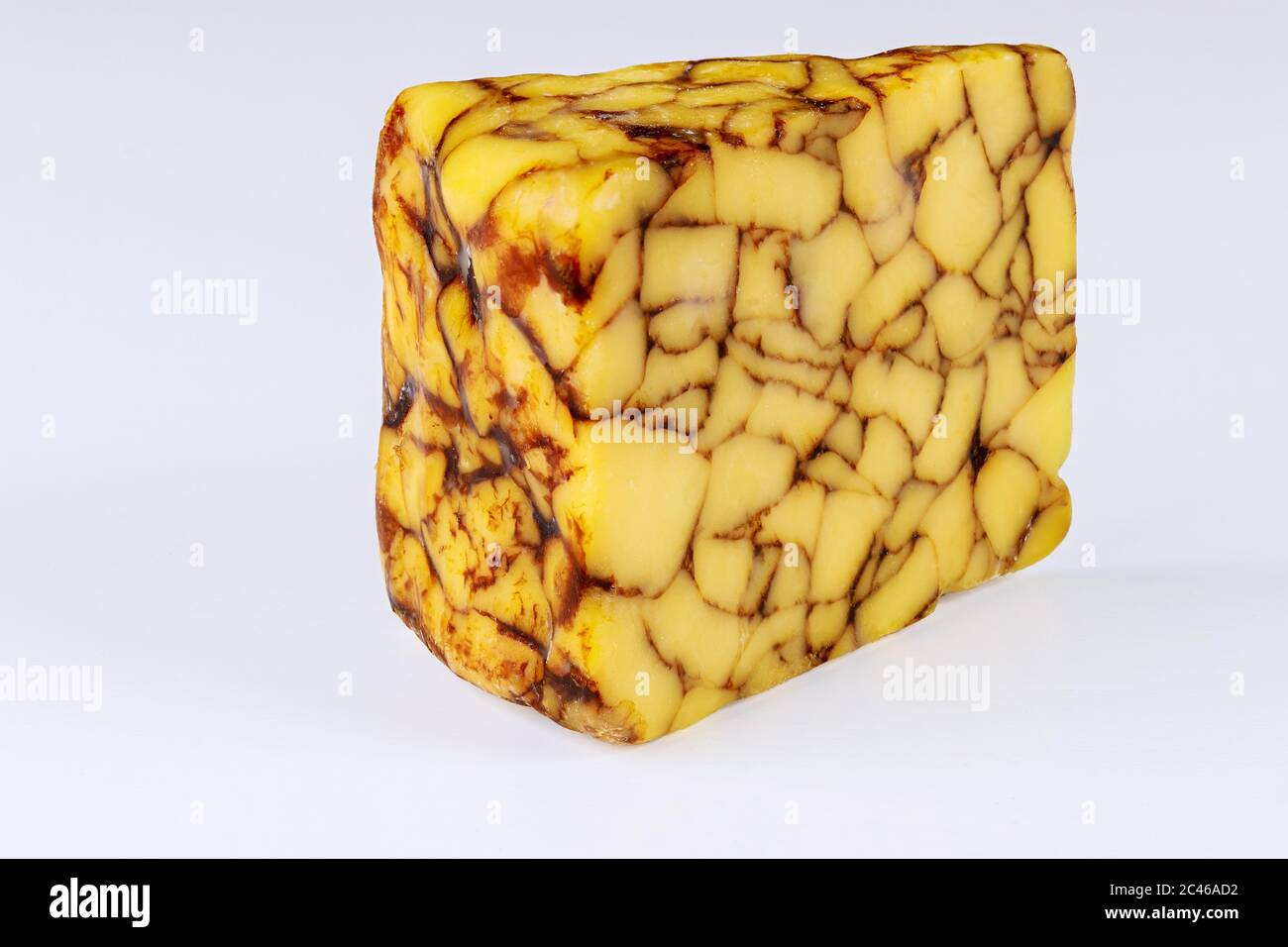 Chunk of cheddar Irish porter cheese on white isolated background Stock ...
