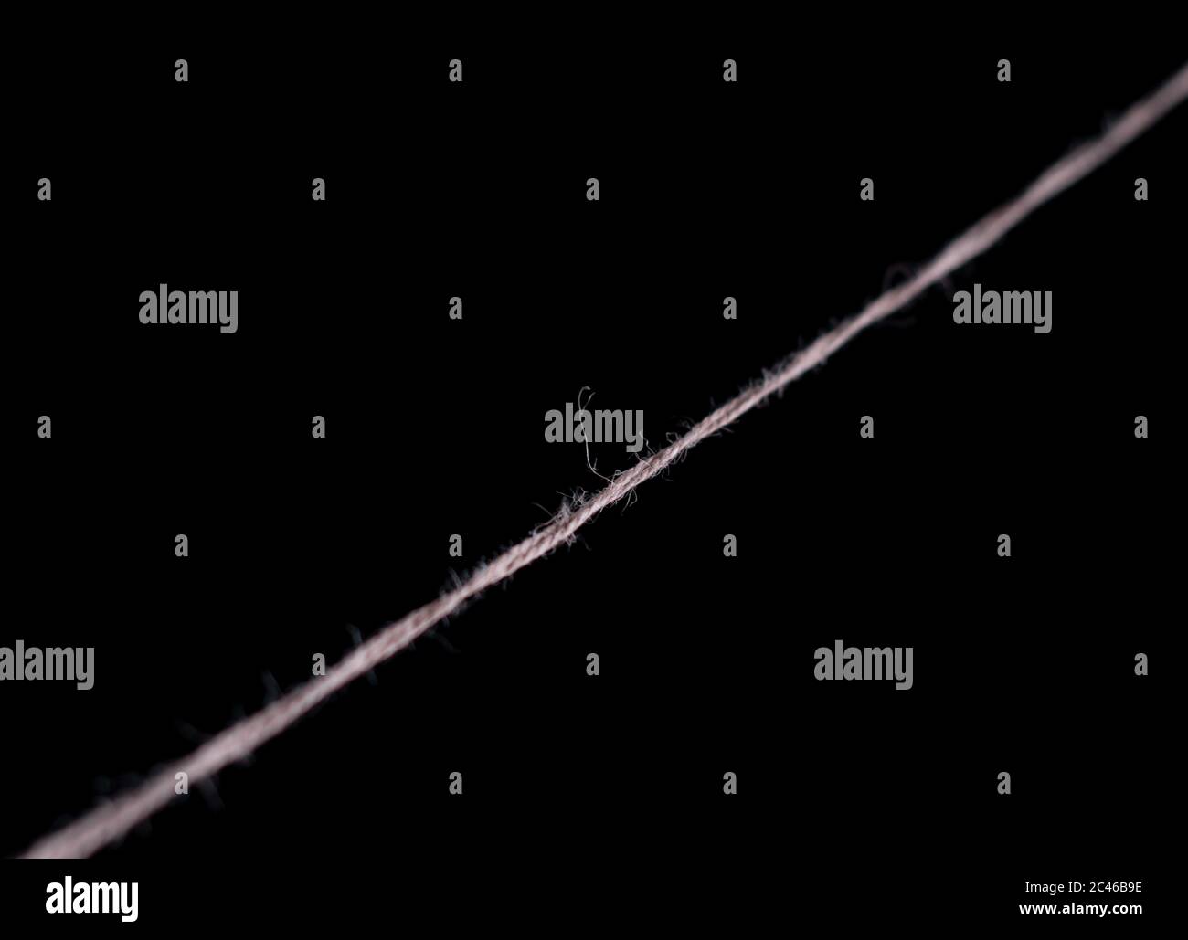 String on the black background Stock Photo - Alamy