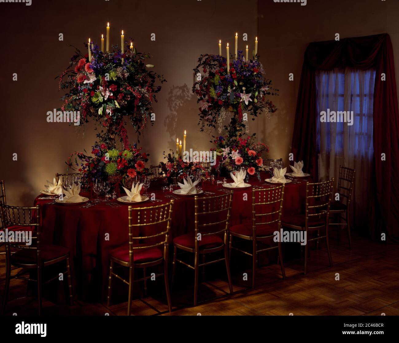 Tables set for evening celebration Stock Photo - Alamy