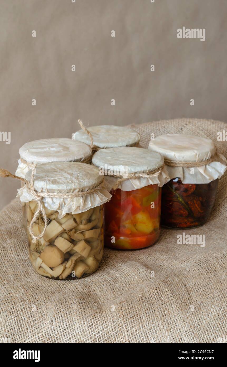 Canned mushrooms, lecho and other home-made canned food. Canned food in ...