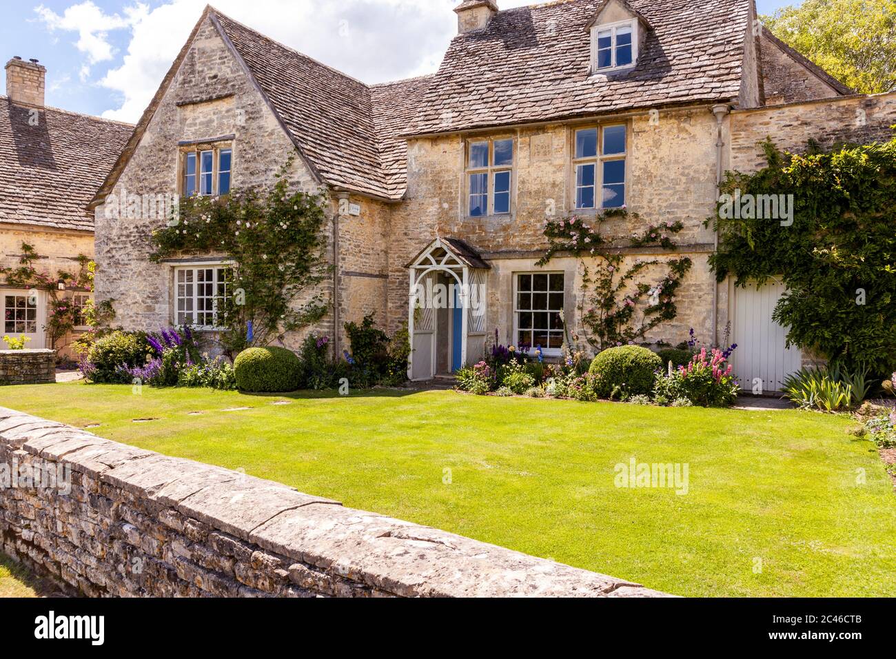 A typical old stone house in the Coln Valley in the Cotswold village of ...