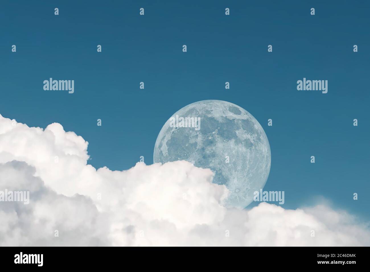Full moon appears during daytime in late afternoon Stock Photo - Alamy