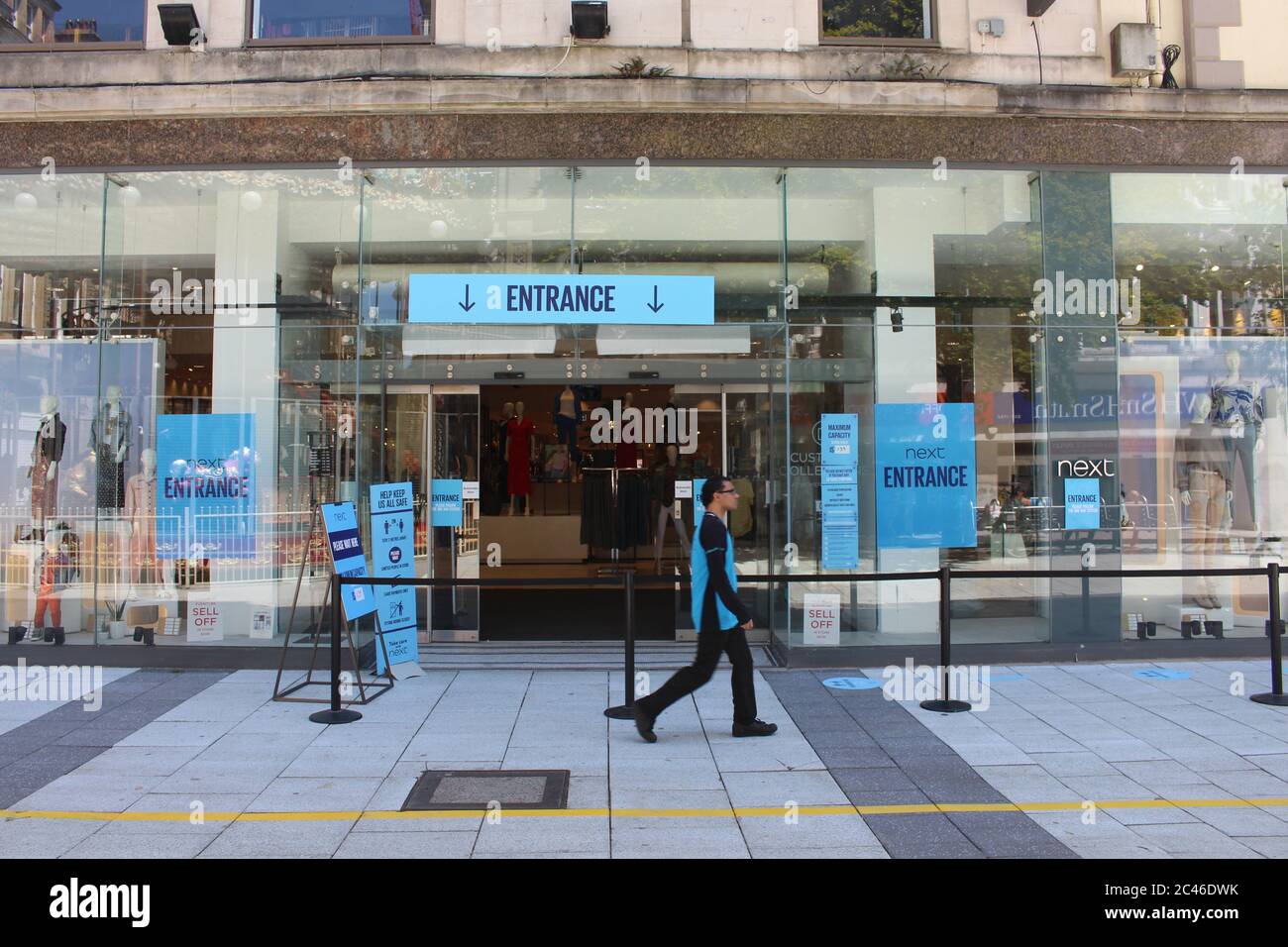A photograph of the Cardiff Next store, with social distancing markers ...