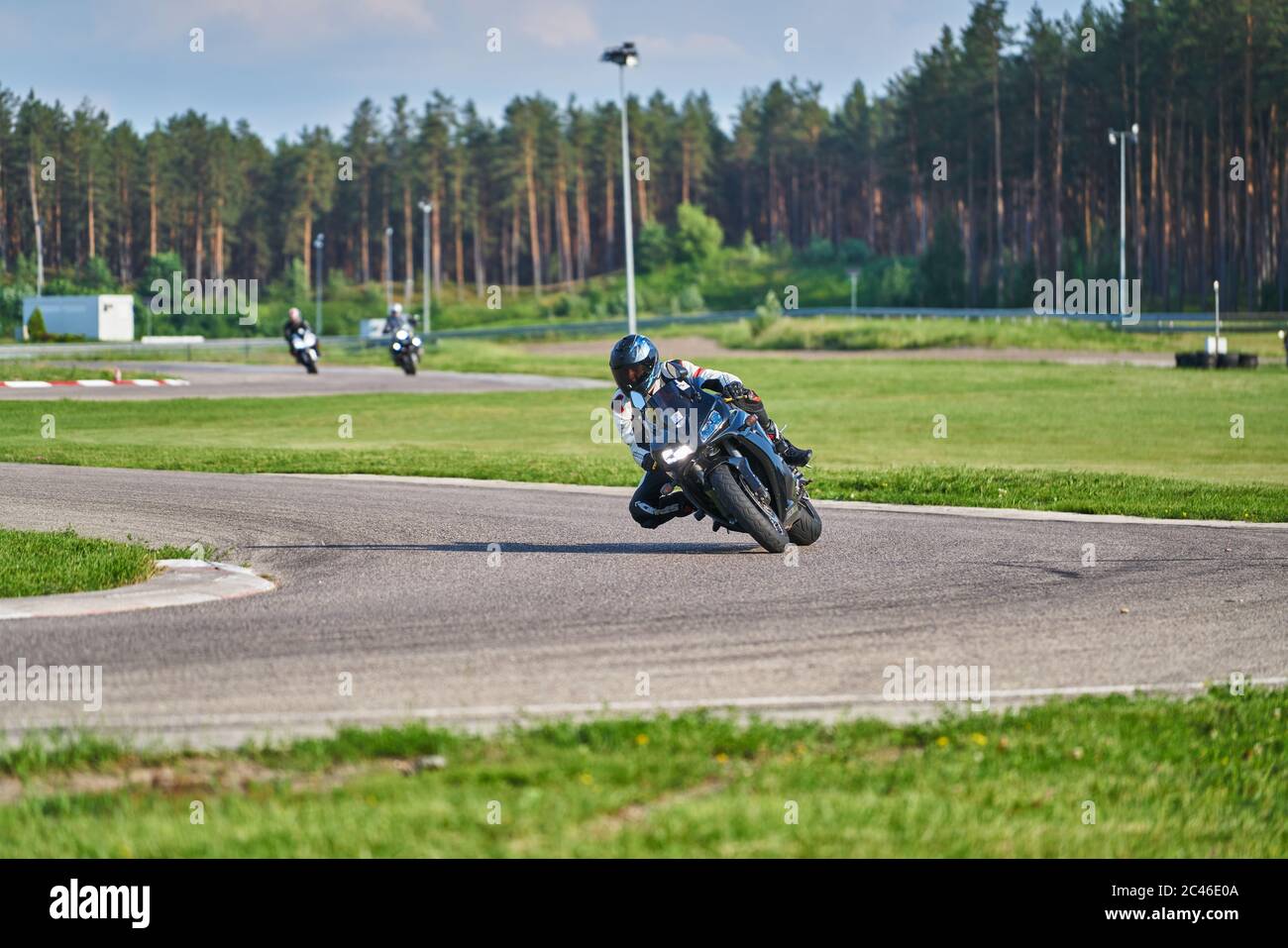 Speeding round a race circuit hi-res stock photography and images - Alamy