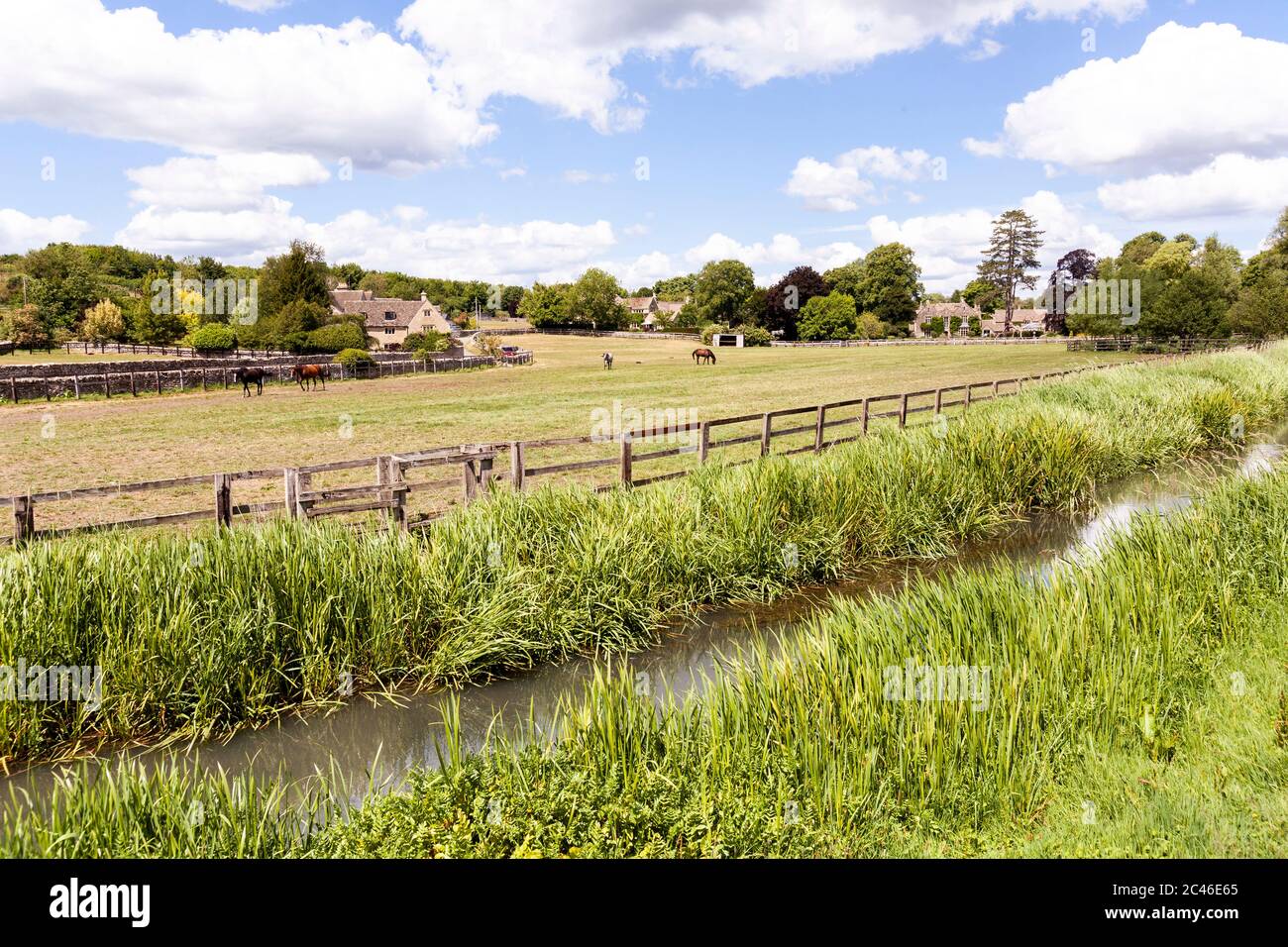 The River Coln passing the Cotswold village of Coln Rogers in the Coln ...