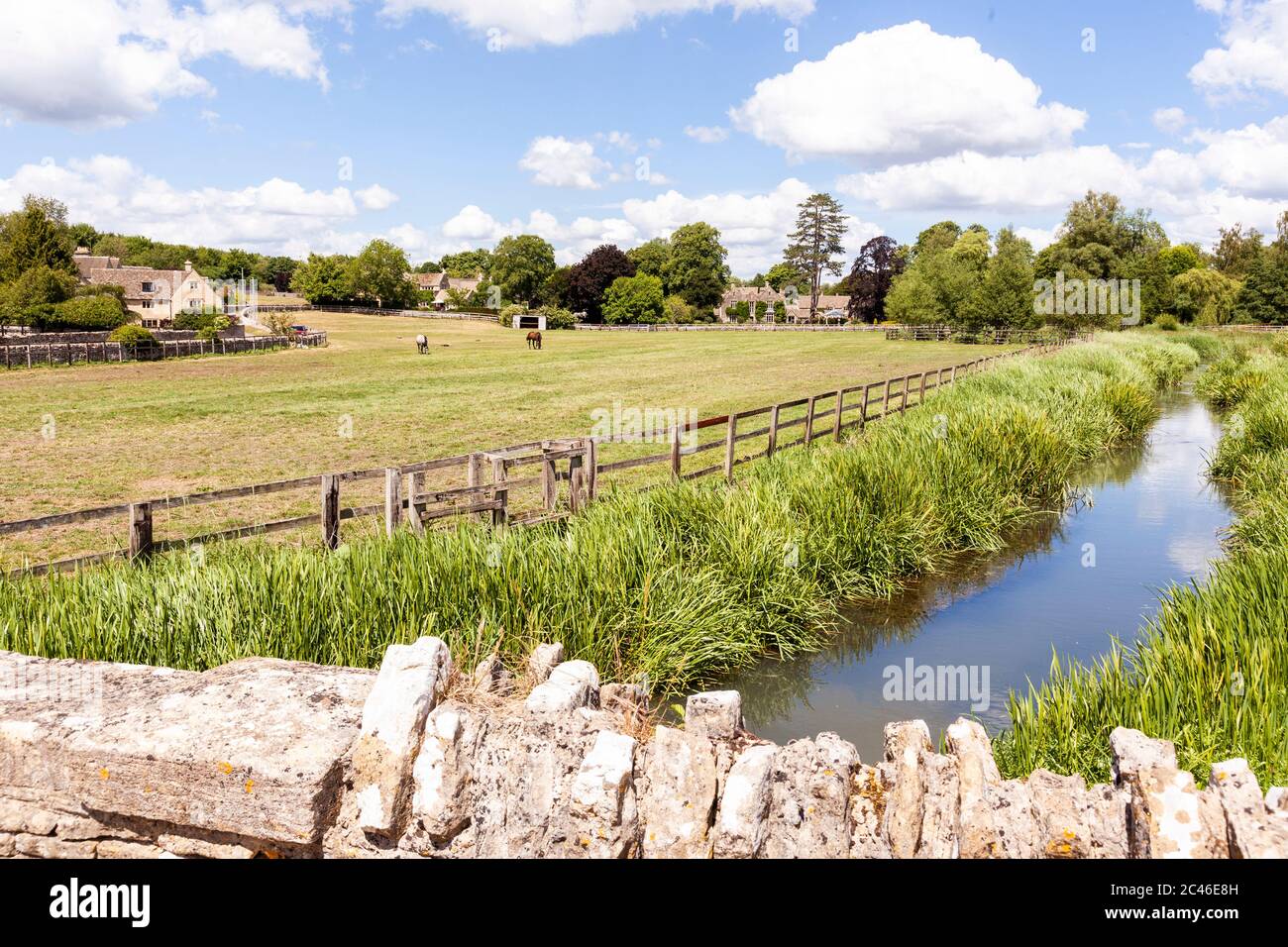 The River Coln passing the Cotswold village of Coln Rogers in the Coln ...