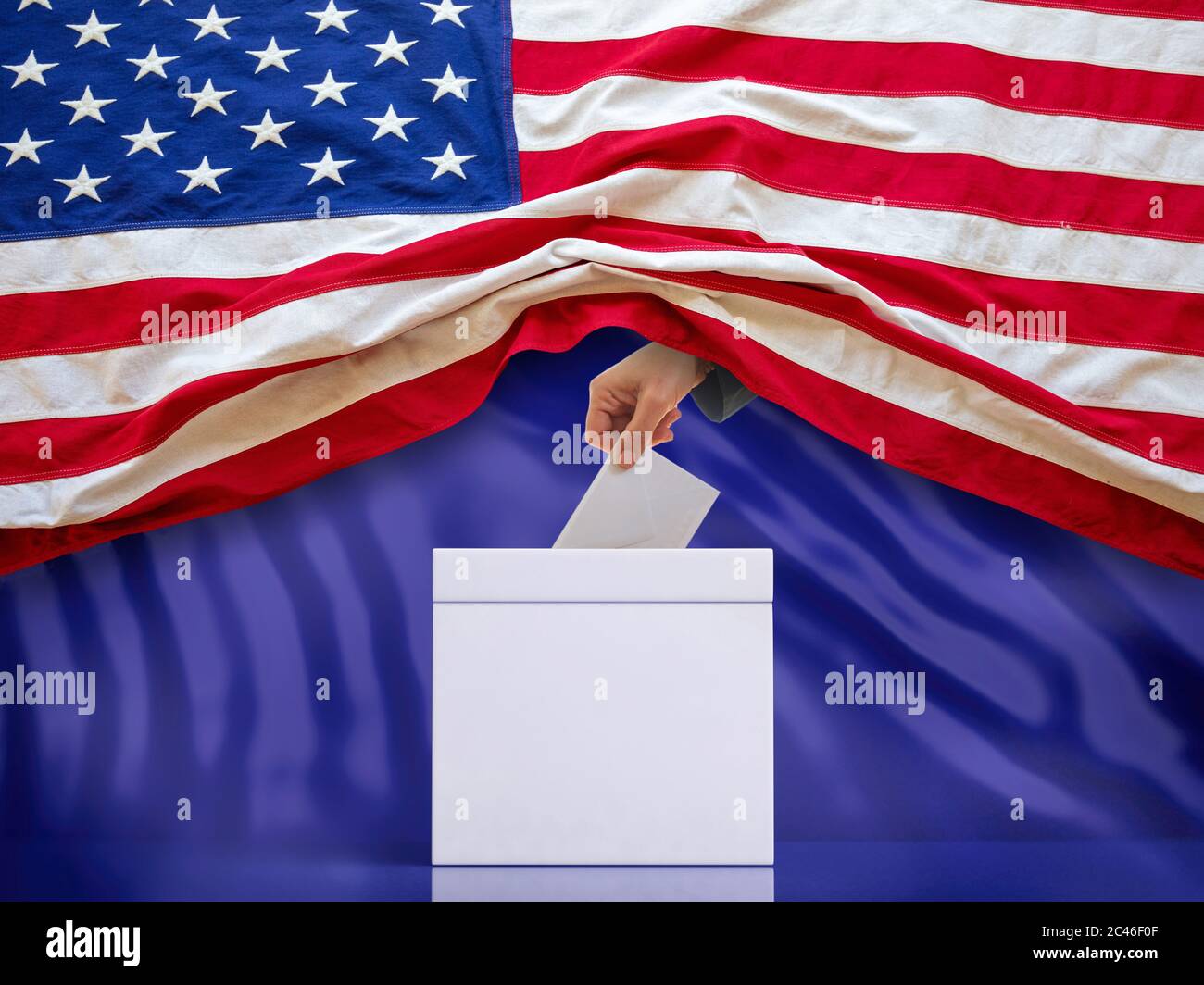 USA election concept. Hand inserting an envelope in a white color ...
