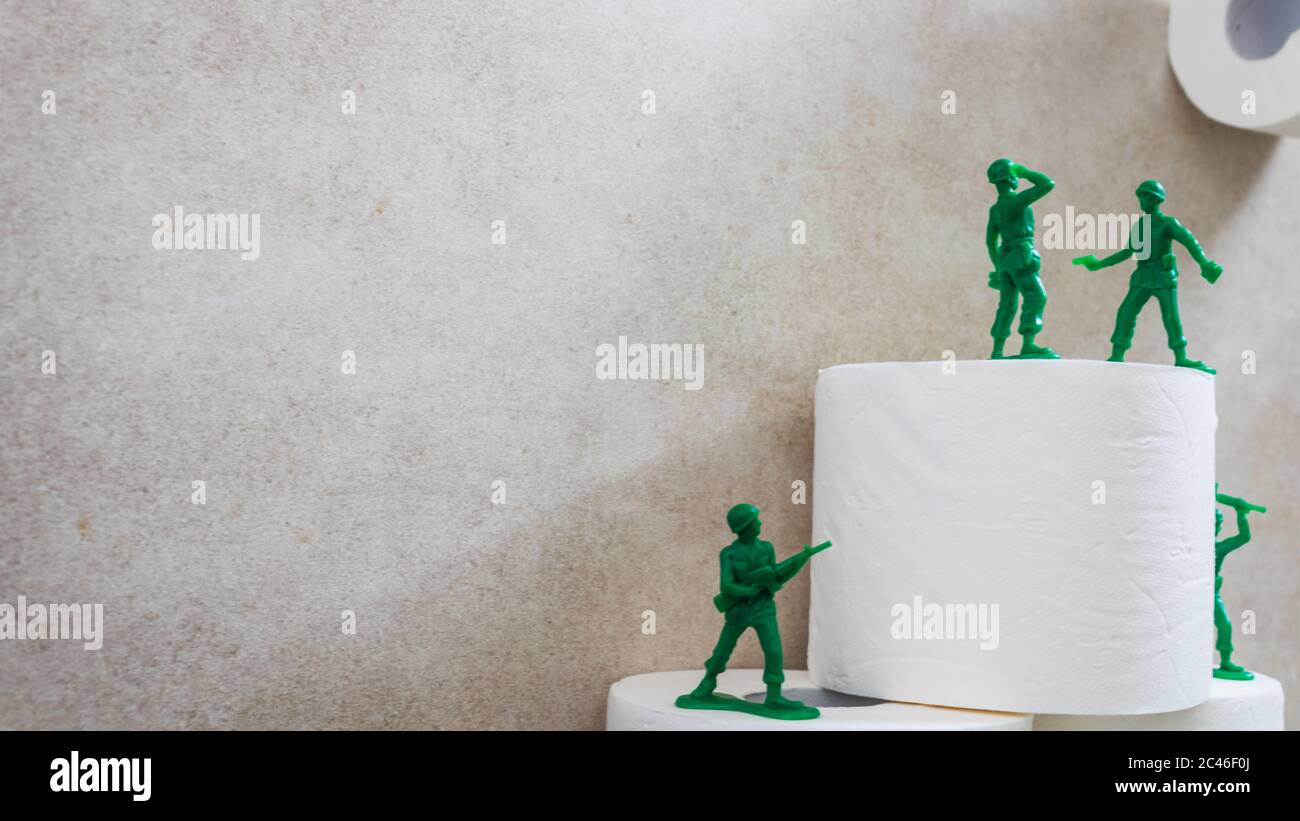 Closeup shot of military green soldier toys on toilet papers Stock ...