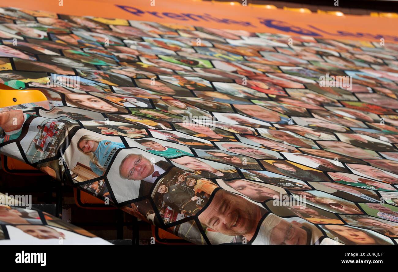 A large banner with Wolves fans printed on covers the stadium seating ...
