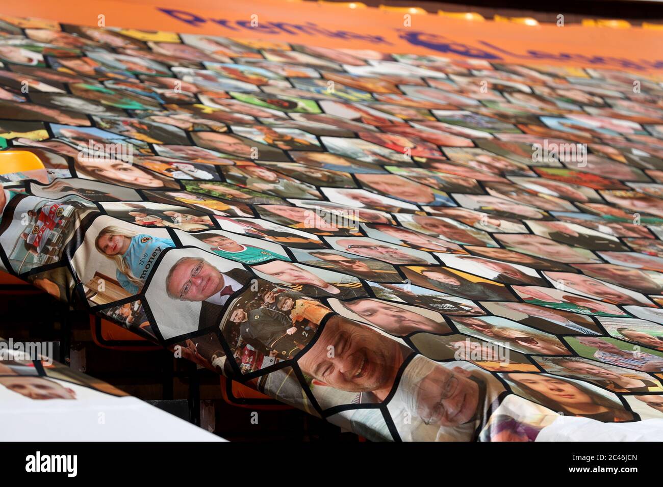 A large banner with Wolves fans printed on covers the stadium seating ...