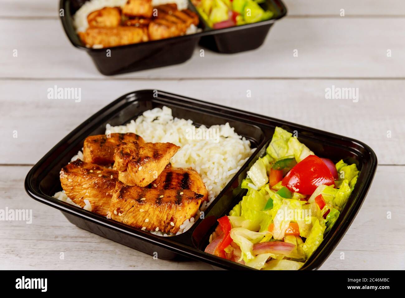 Healthy food delivery or take away lunch in plastic container. Close up ...