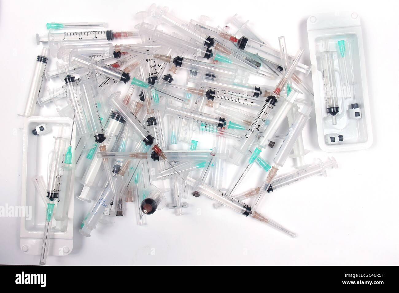 Large pile of used medical syringes with needles Stock Photo - Alamy