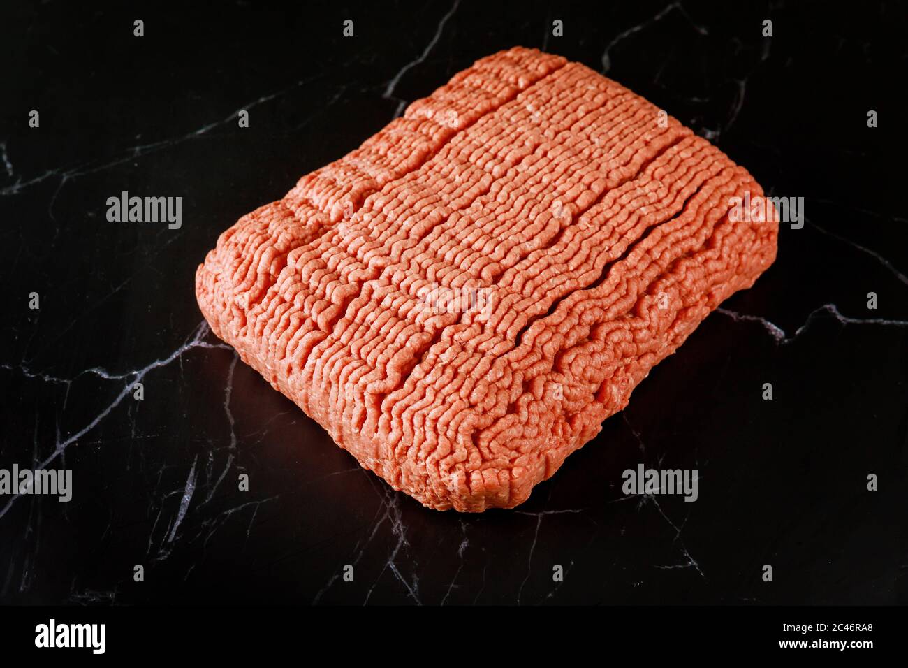 Raw ground beef with texture on black background. Top view Stock Photo ...