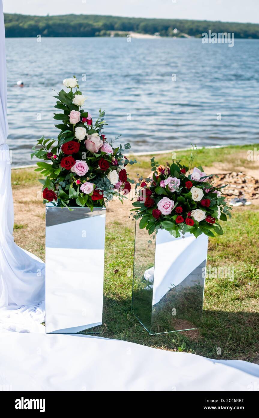 flowers standing in a square mirror pot Stock Photo - Alamy