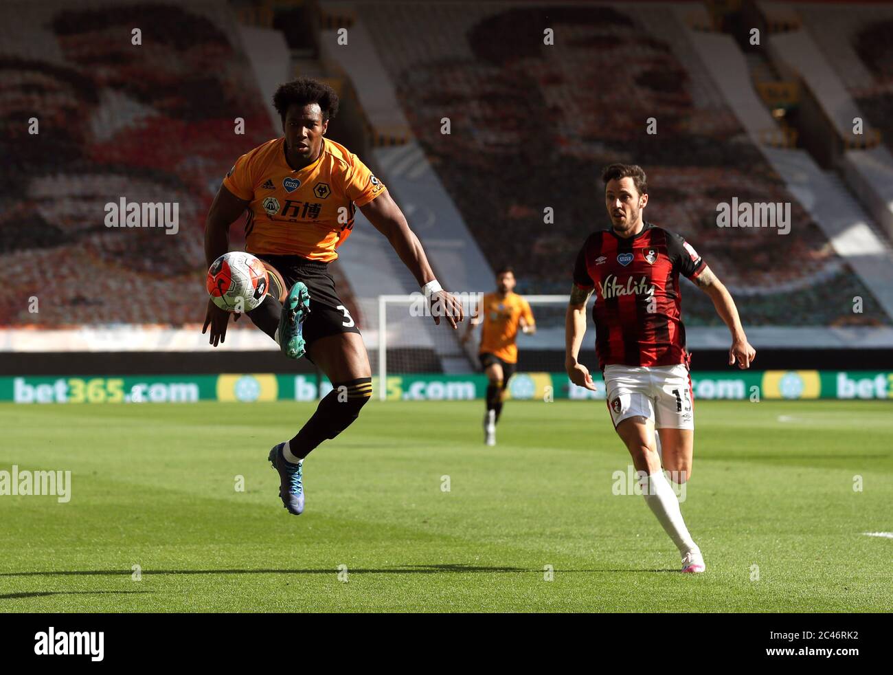 Wolverhampton Wanderers' Adama Traore (left) and AFC Bournemouth Adam ...