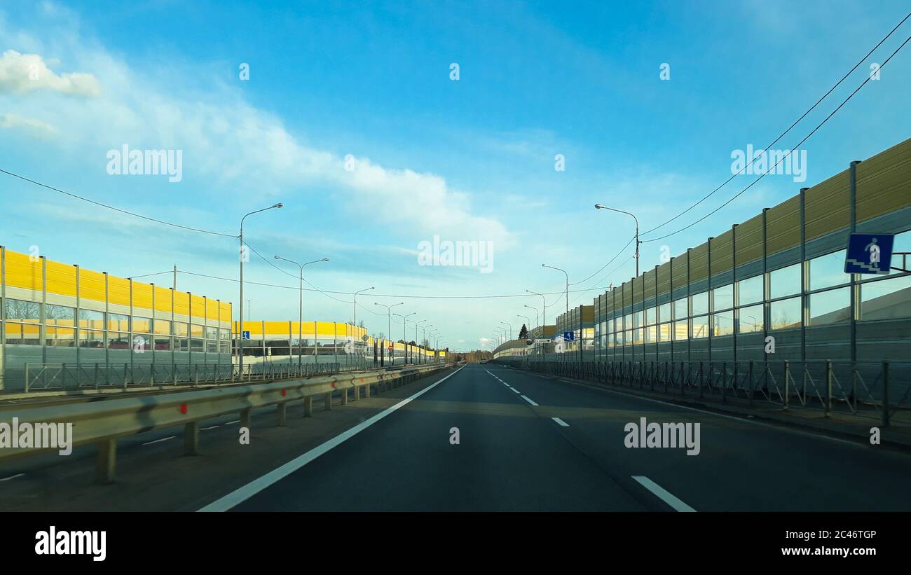 A road or highway leading to the horizon. View from the car window ...