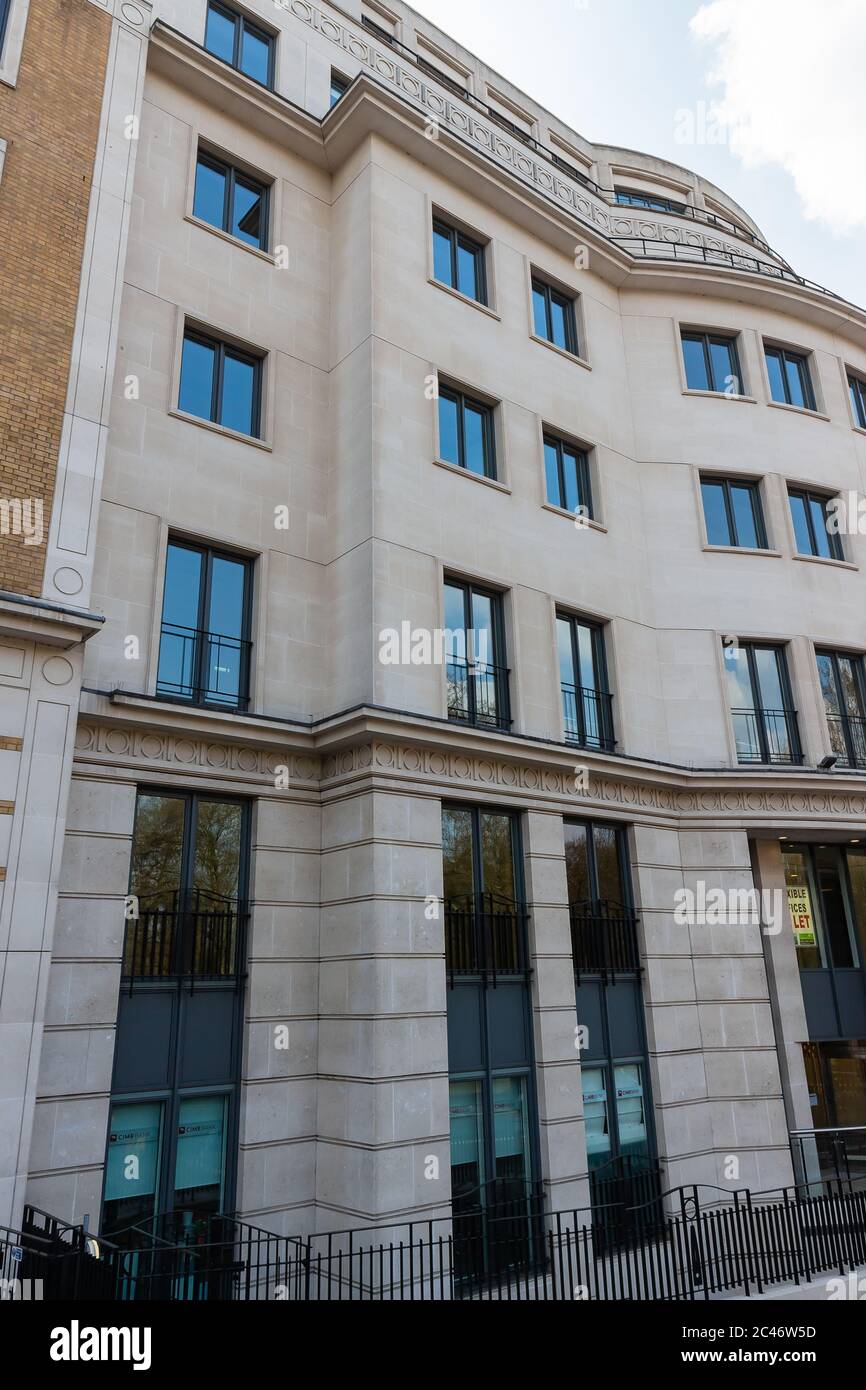 Low angle shot of the modern building with glass windows in London ...