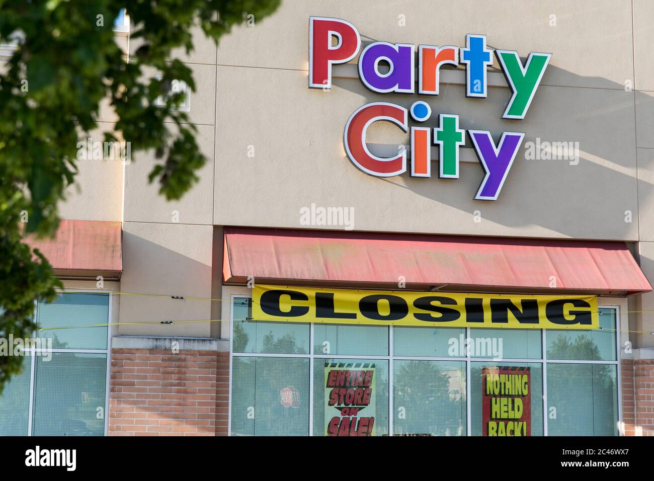'Store Closing' signage outside of a Party City retail store location ...