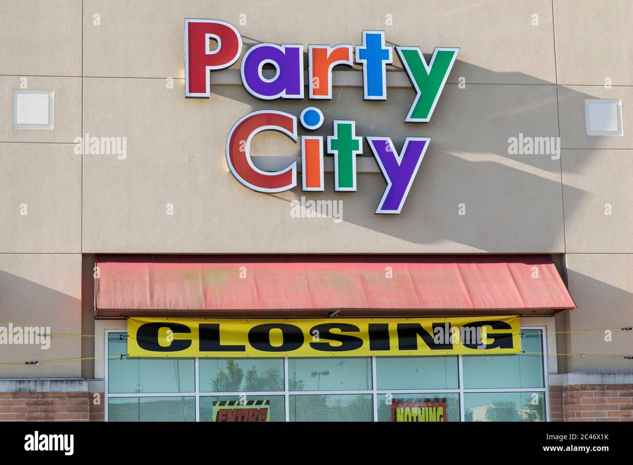 'Store Closing' signage outside of a Party City retail store location ...