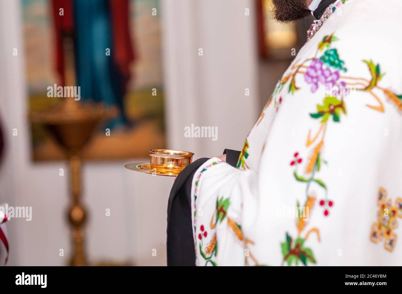 Hands holding eucharist in church hi-res stock photography and images ...