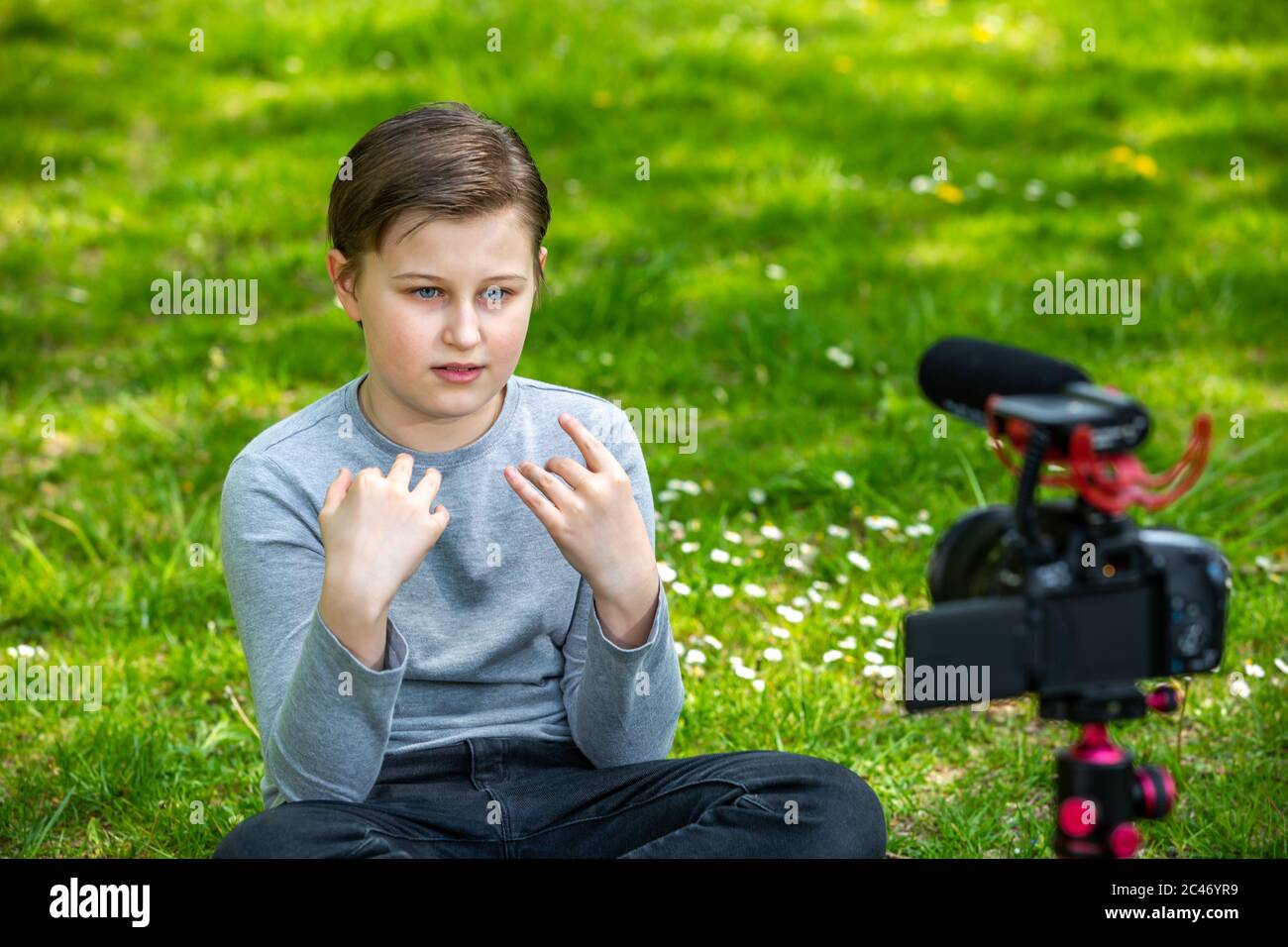 Blogging and vlogging concept, happy smiling boy or blogger with camera ...