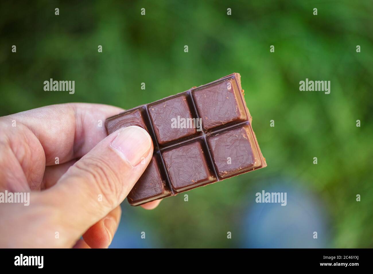 Hand chocolate bar hi-res stock photography and images - Alamy