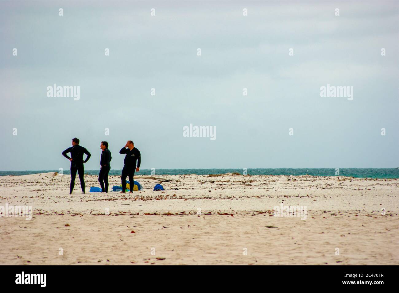 Three Divers on a Beach Stock Photo - Alamy