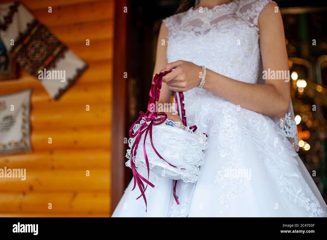 Bride is going to throwing candy from the basket Stock Photo - Alamy