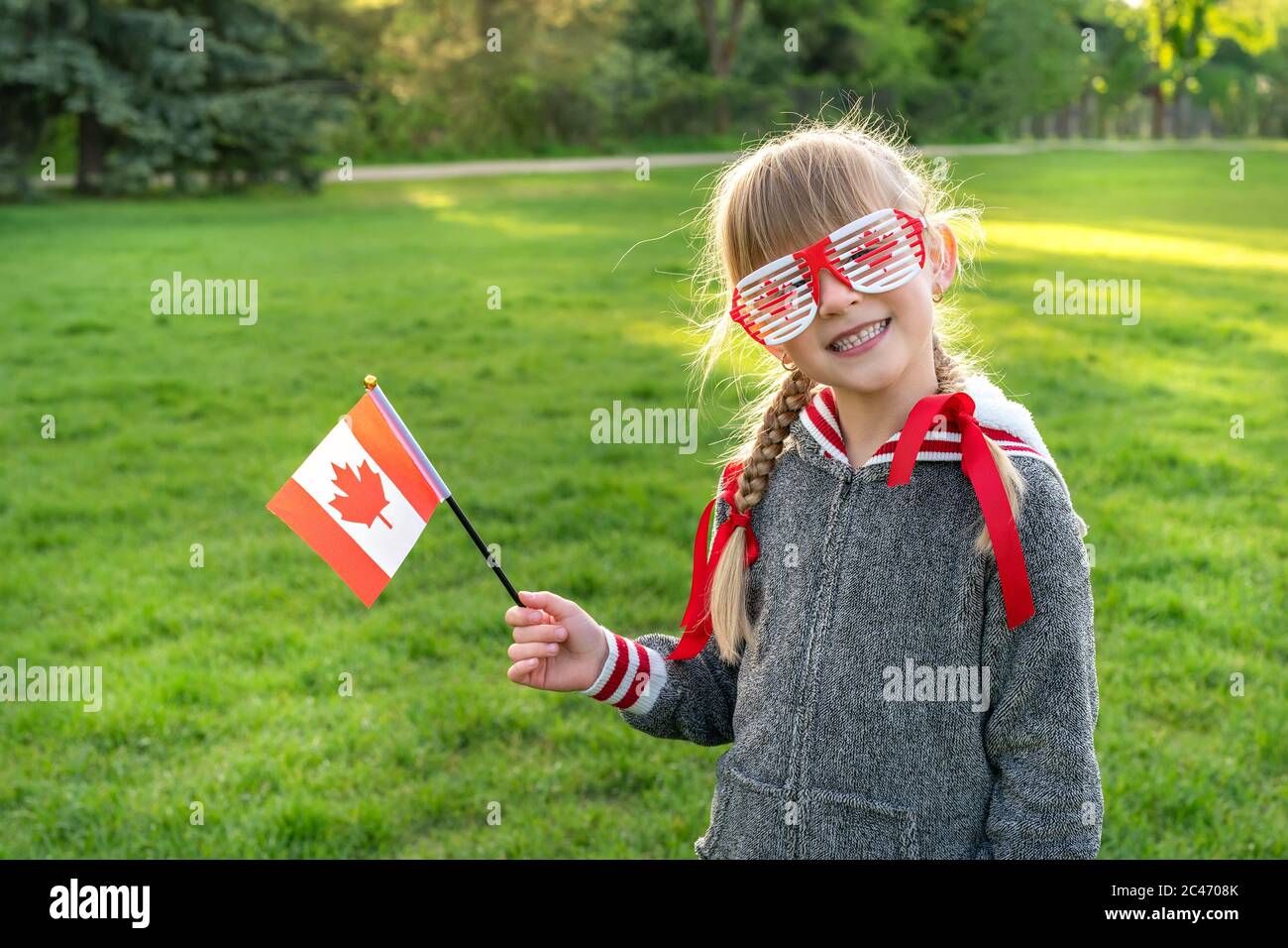 Happy Canda Day Celebrtation concept. Young cute female child with ...