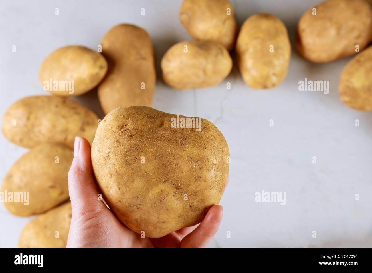 Hand shaped potato hi-res stock photography and images - Alamy