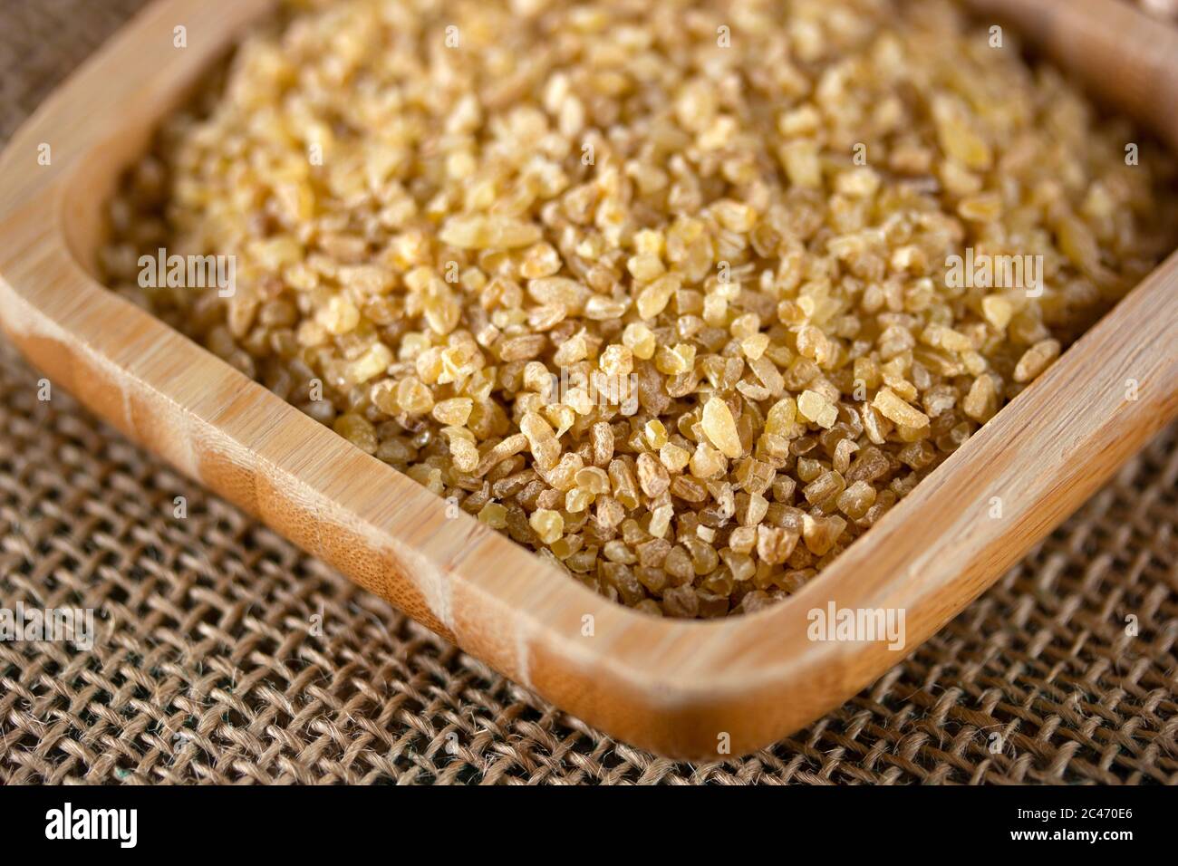 raw wheat grains in wooden plate Stock Photo - Alamy
