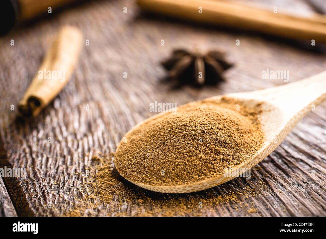 spoon of powdered cinnamon, spice obtained from the inner bark of ...