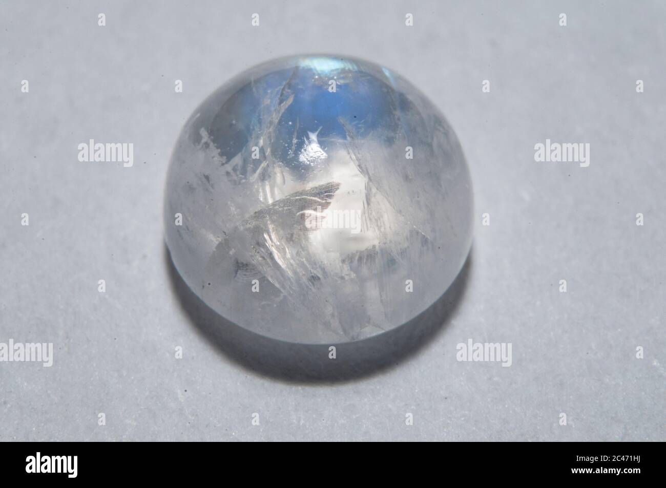 Natural white blue adular moonstone on the white background Stock Photo ...