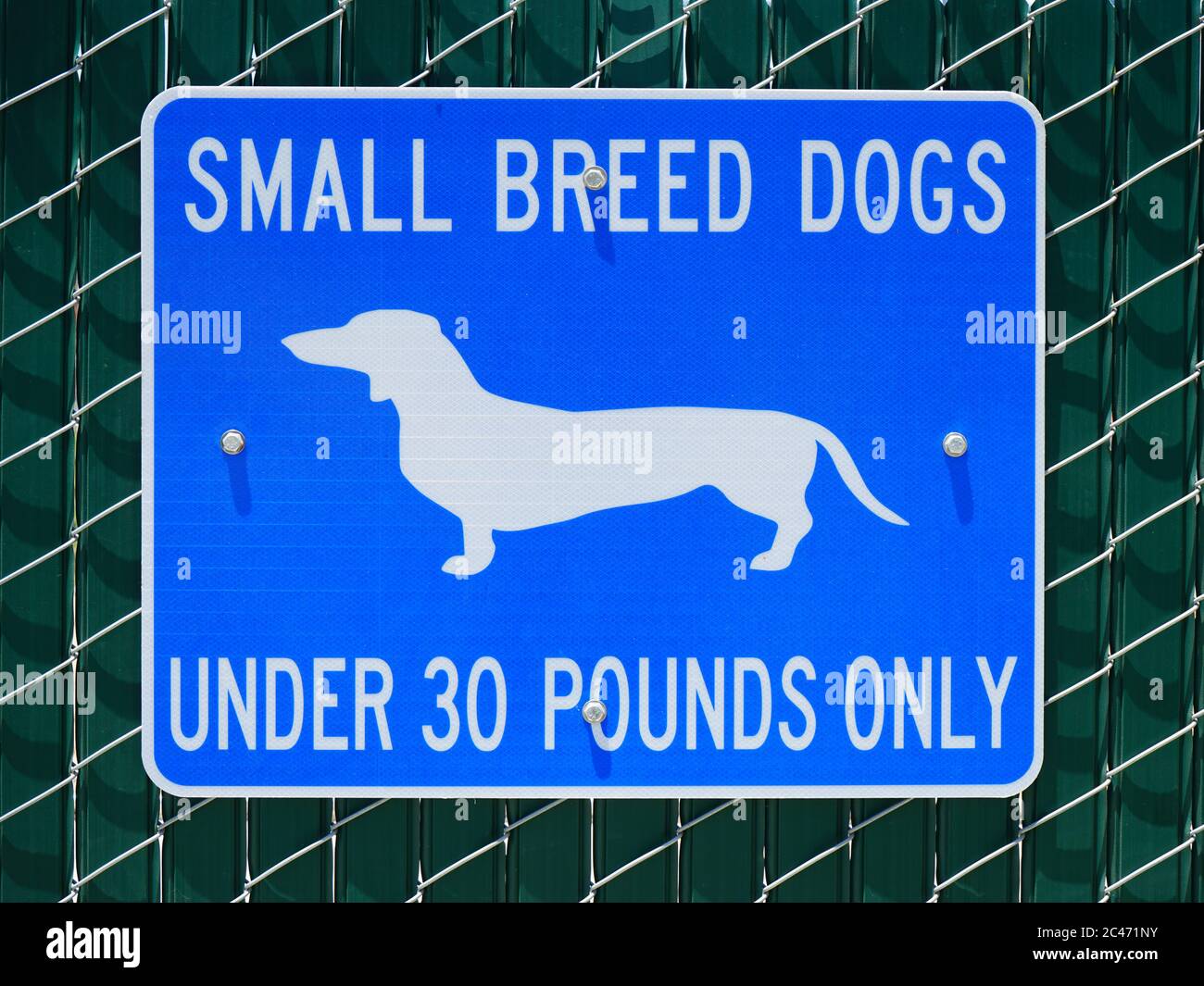 Dog park sign small breed dogs only Stock Photo - Alamy