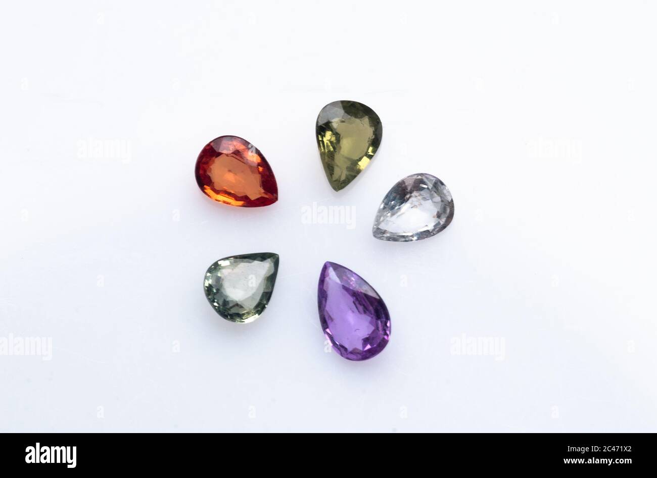 Colorfull natural sapphires in pear shape on the white background Stock ...