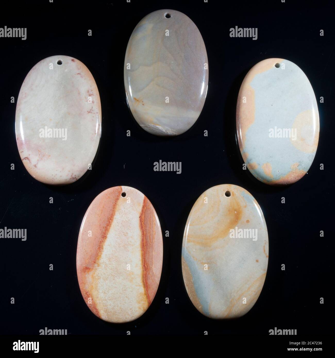 Natural multi color jasper on the black background Stock Photo - Alamy