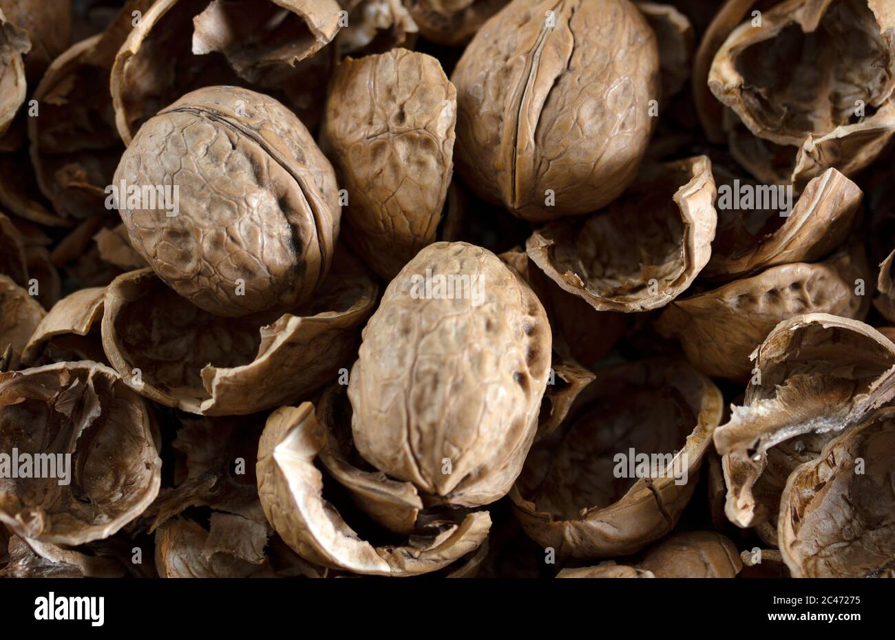 walnut shell and walnut texture background Stock Photo - Alamy