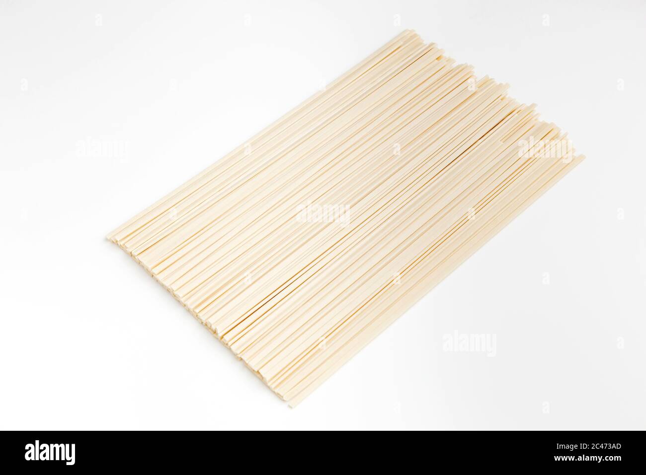 Raw udon noodles on white, horizontal photo Stock Photo - Alamy