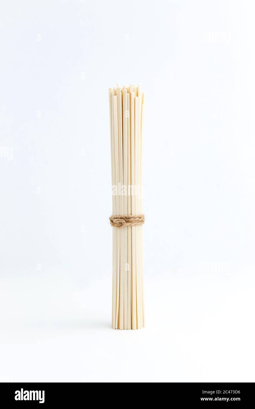 A bunch of raw udon noodles on white Stock Photo - Alamy